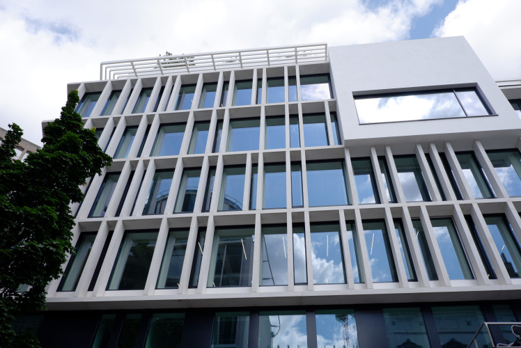 K-Nopy Office Building Renovation | White Concrete Facade and City Furniture | Aalborg